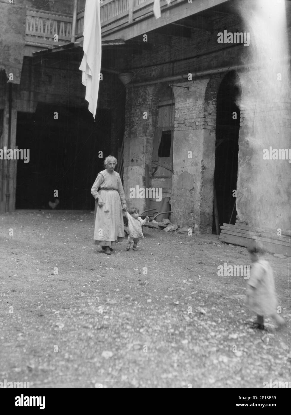 Woman and children in a courtyard, New Orleans, between 1920 and 1926 ...
