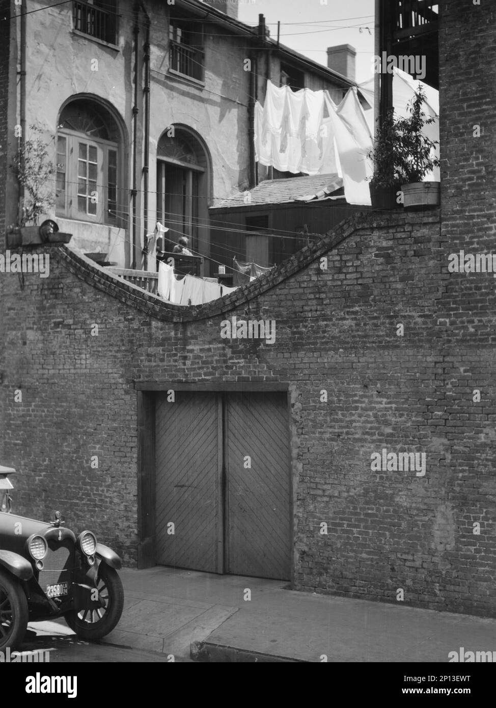 Courtyard with a garage, New Orleans, between 1920 and 1926 Stock Photo ...