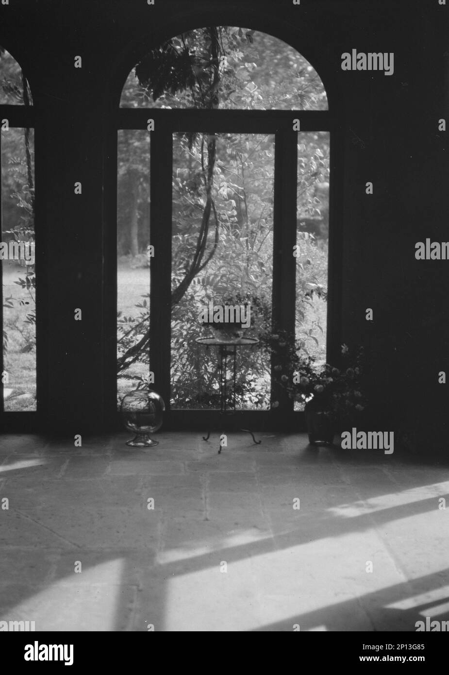 View through arched window into a courtyard, New Orleans or Charleston ...