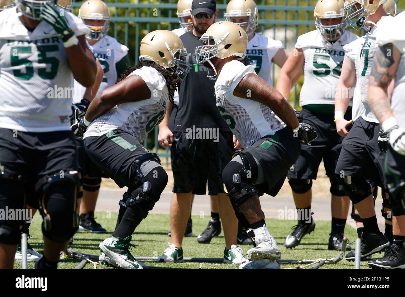 Baylor offensive lineman Ishmael Wilson, left and Mo Porter work ...