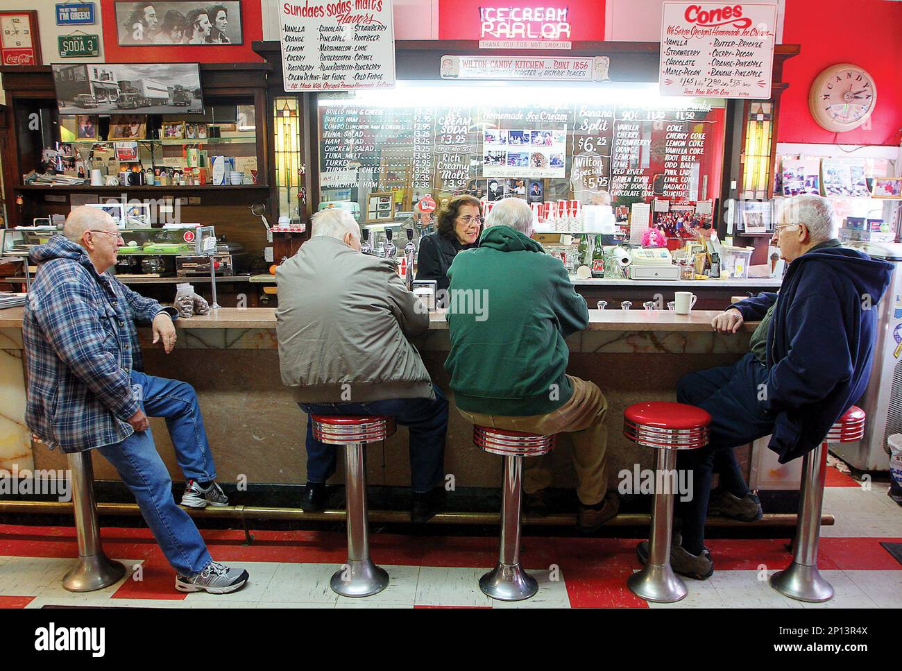 This June 28, 2012 photo shows customers inside The Candy Kitchen in ...