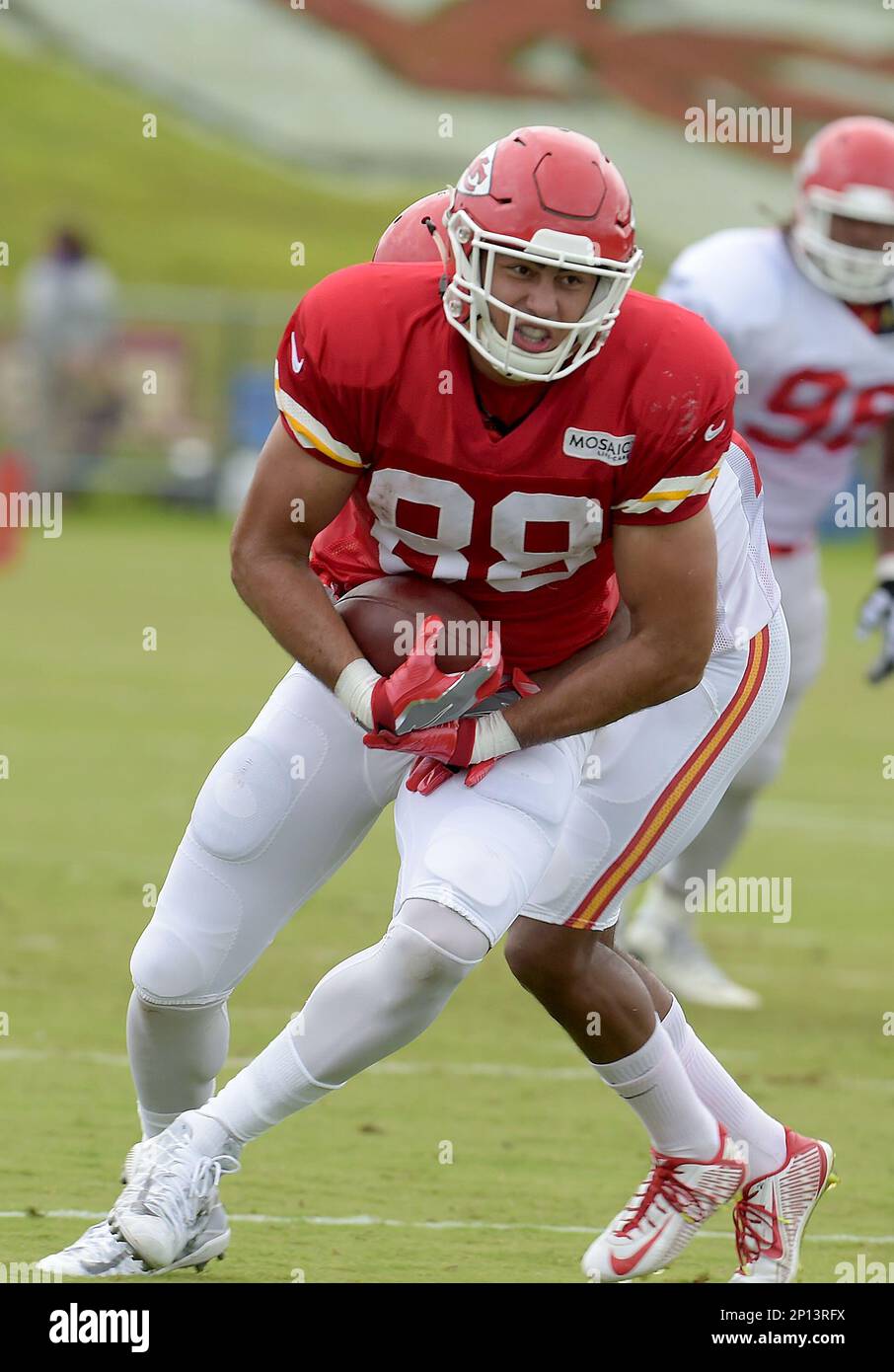 Kansas City Chiefs tight end Ross Travis is tackled by cornerback ...