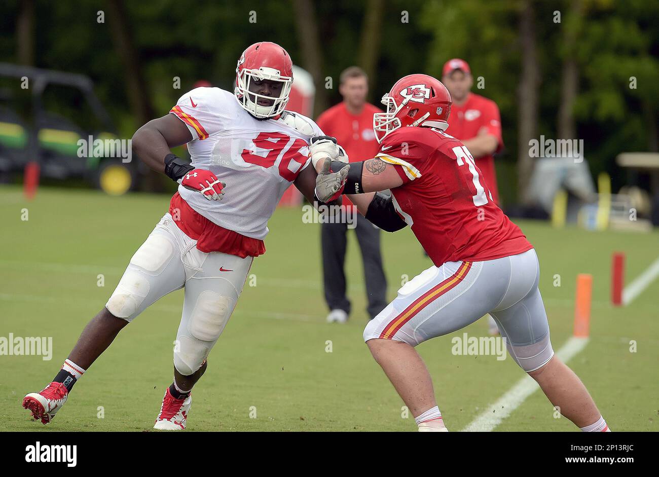 Kansas City Chiefs defensive lineman Jaye Howard, left, and offensive ...