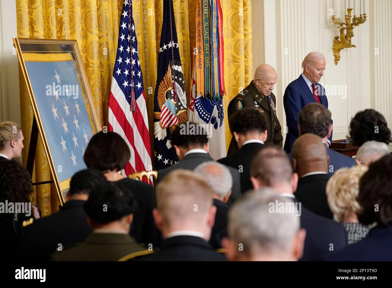 President Joe Biden stands with retired Army Col. Paris Davis as a ...