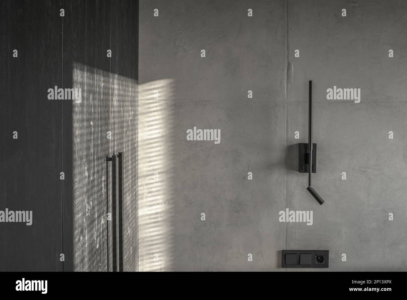 Minimalistic black wall light in modern interior in grey and black ...