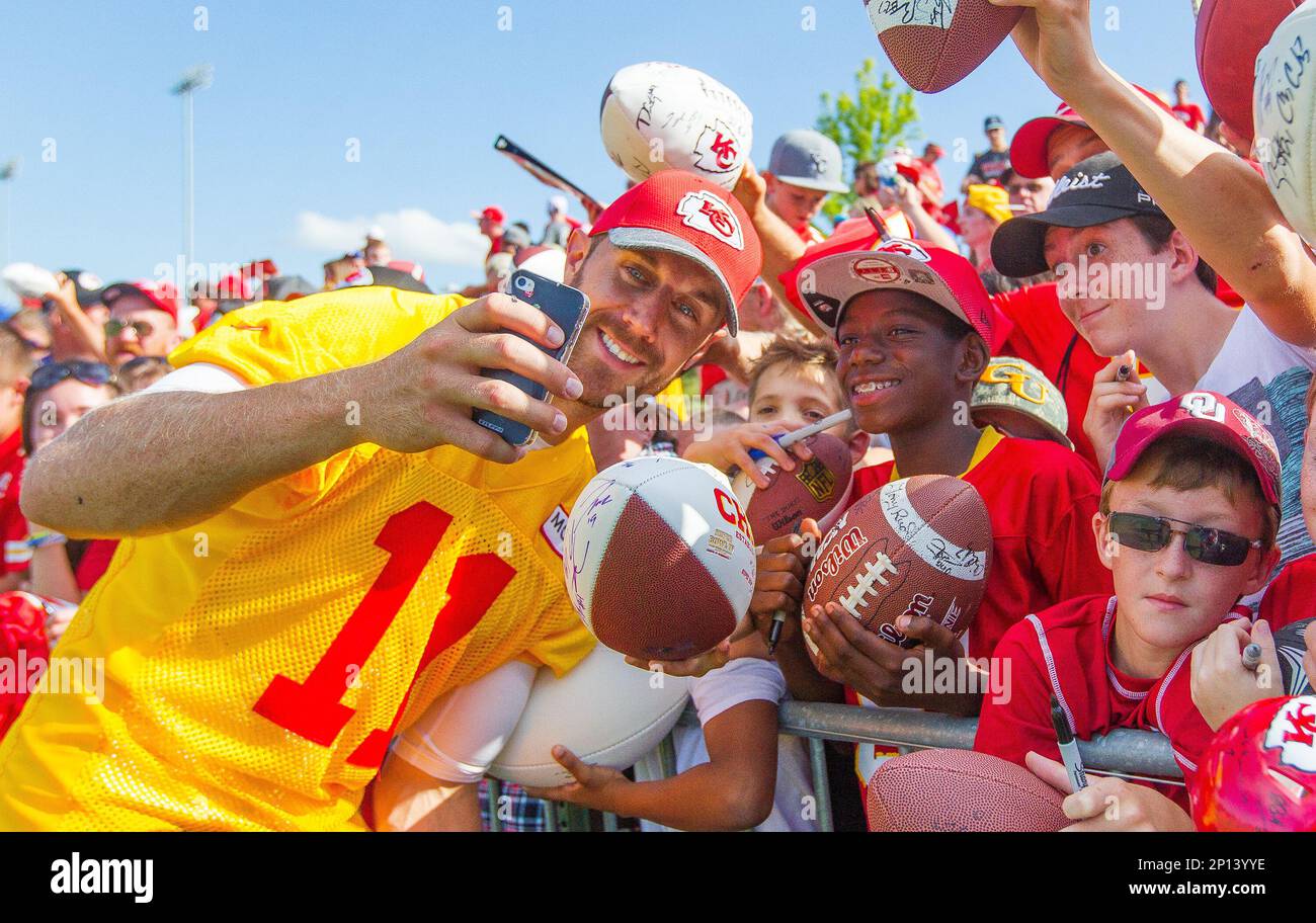 Kansas City Chiefs quarterback Alex Smith takes a photo with fans after ...