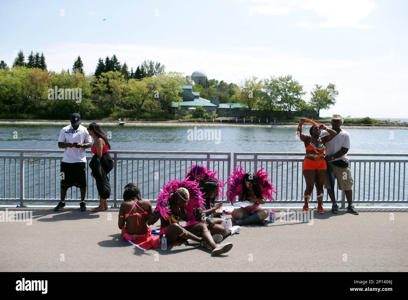 Mas band members take a lunch break along the parade route at the ...