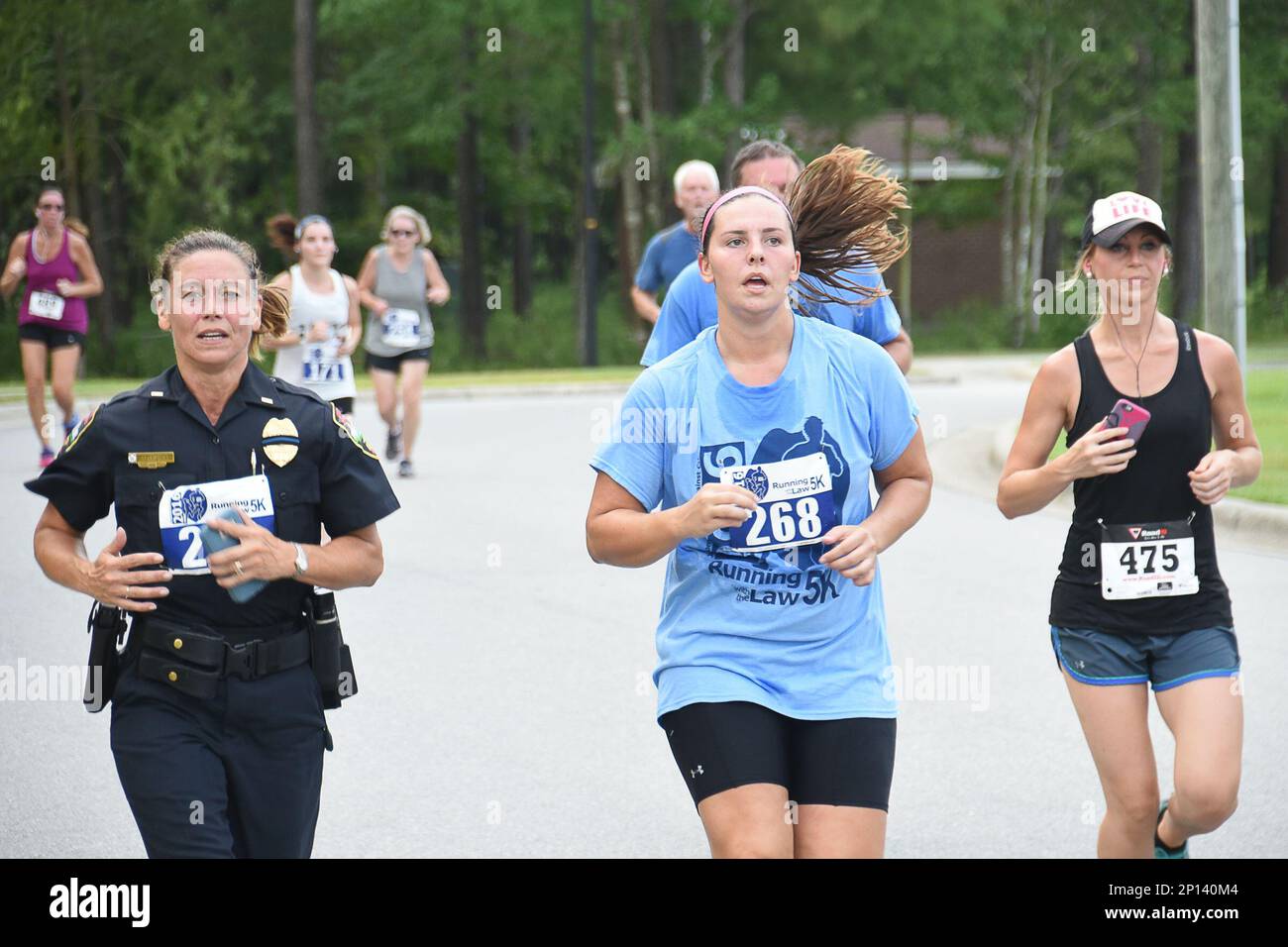Jacksonville Police Officer Staci Leyble, left, runs in her full ...