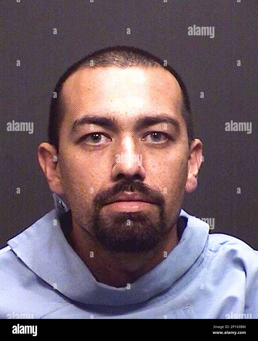 This undated booking photo provided by the Tucson Police Department ...
