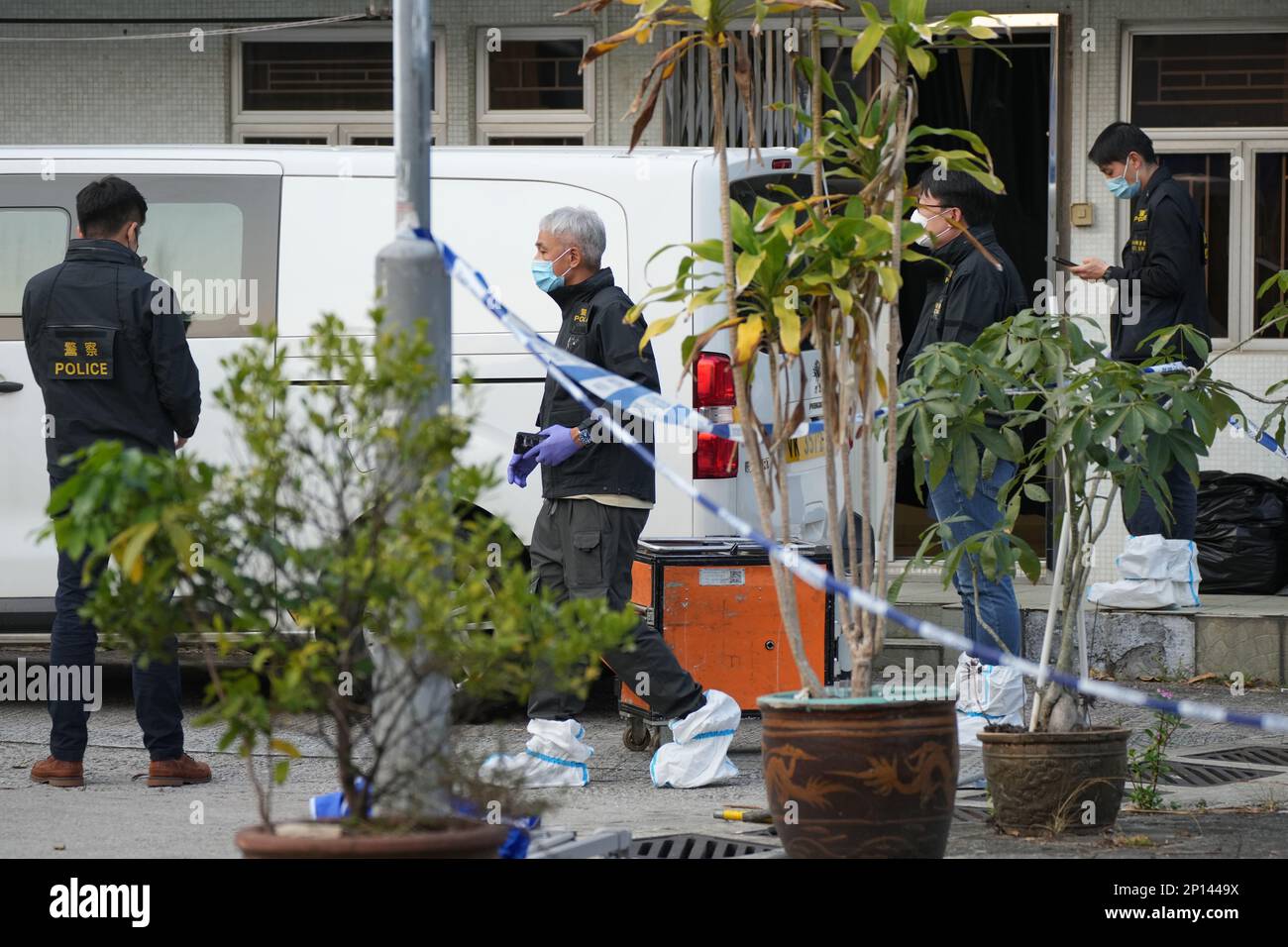 Police officers continue investigation in the murder crime scene at ...