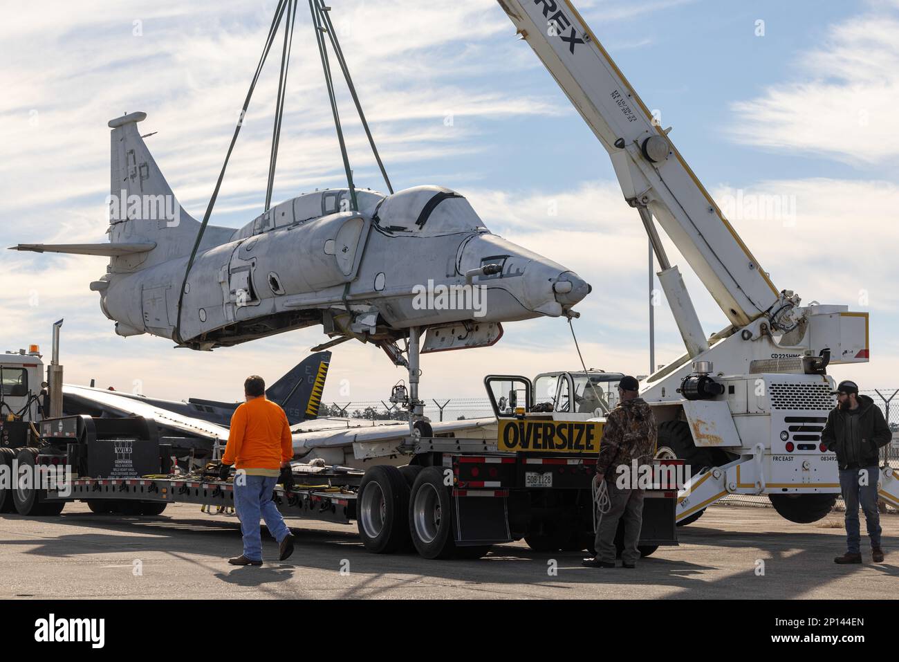 Fleet Readiness Center East (FRCE) contractors lift the body of an A-4M ...
