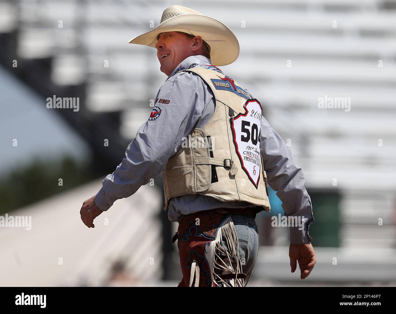 Chet Johnson of Douglas, Wyo., looks back at the scoreboard after his ...