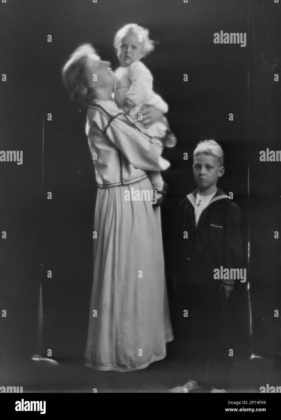 Portrait mother son holding glass Black and White Stock Photos & Images ...
