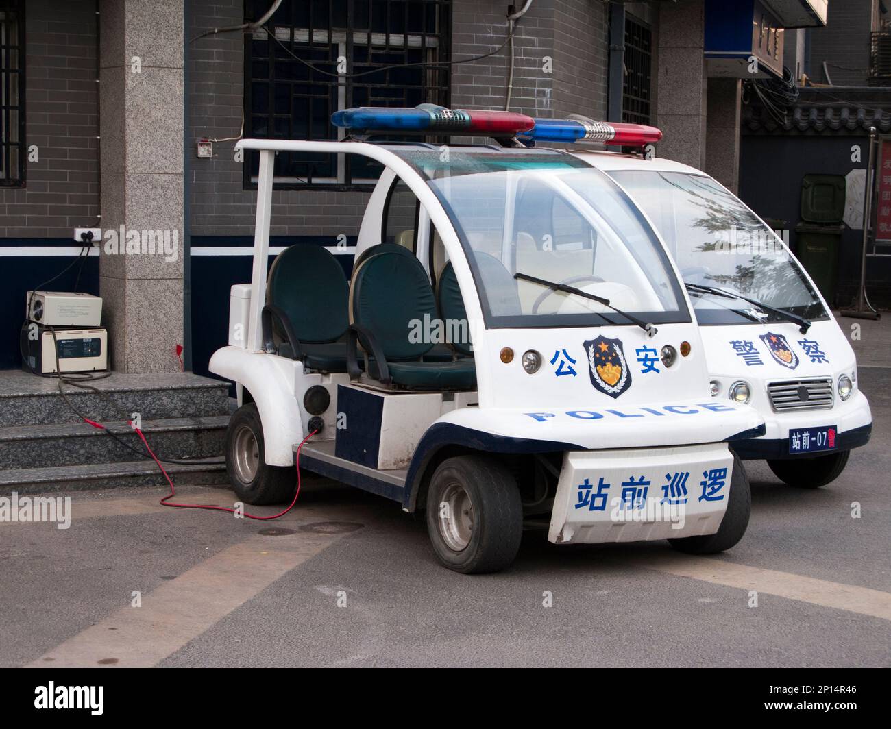 Charging an EV Police traffic car / electric vehicle designed for use ...