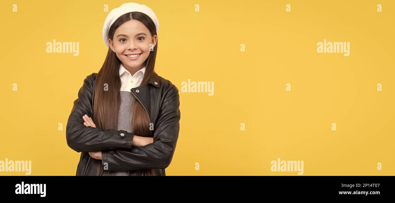 Confident school age girl child happy smile keeping arms crossed yellow ...