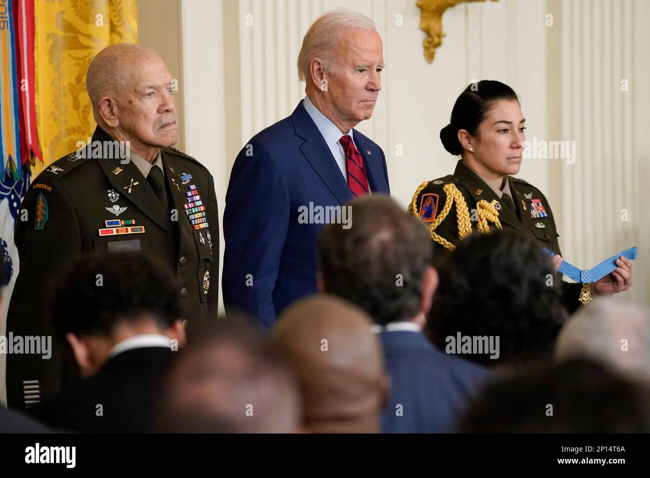 President Joe Biden stands with retired Army Col. Paris Davis before awarding the Medal of Honor ...