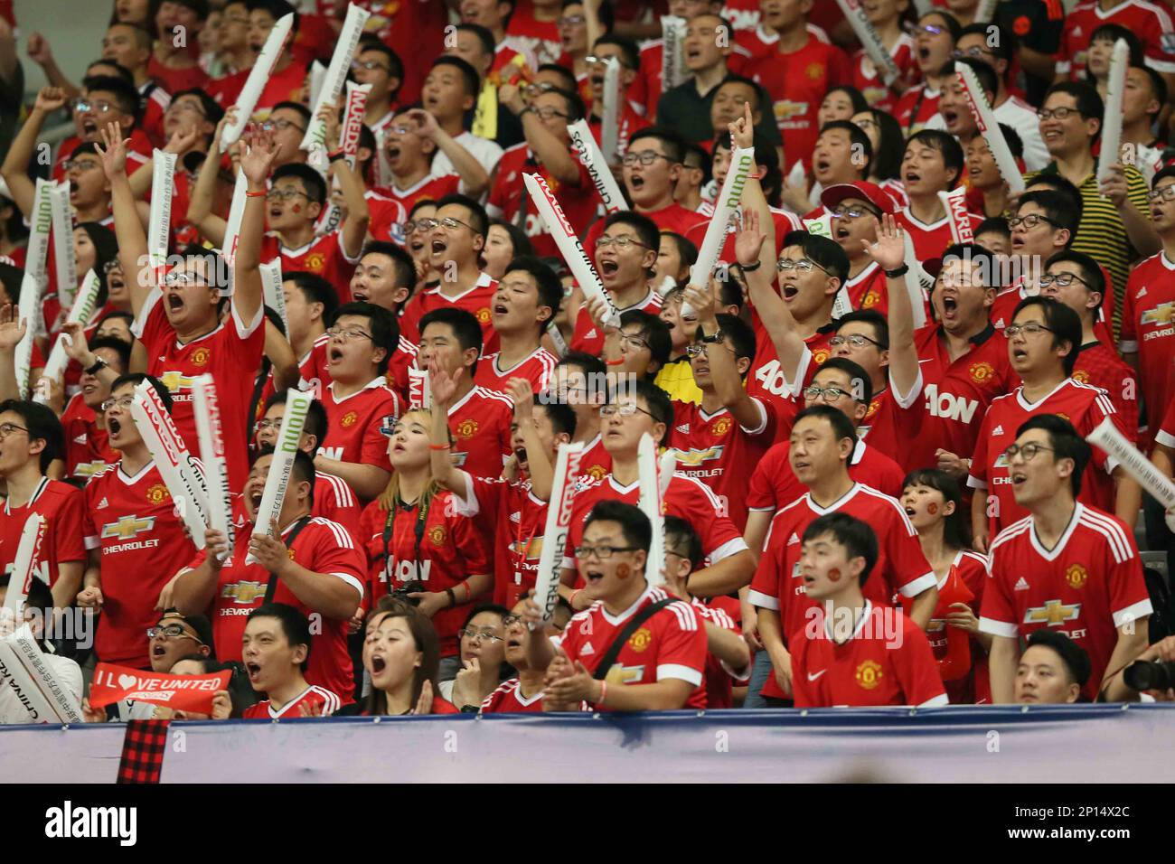 Chinese football fans shout slogans to show support for Manchester ...