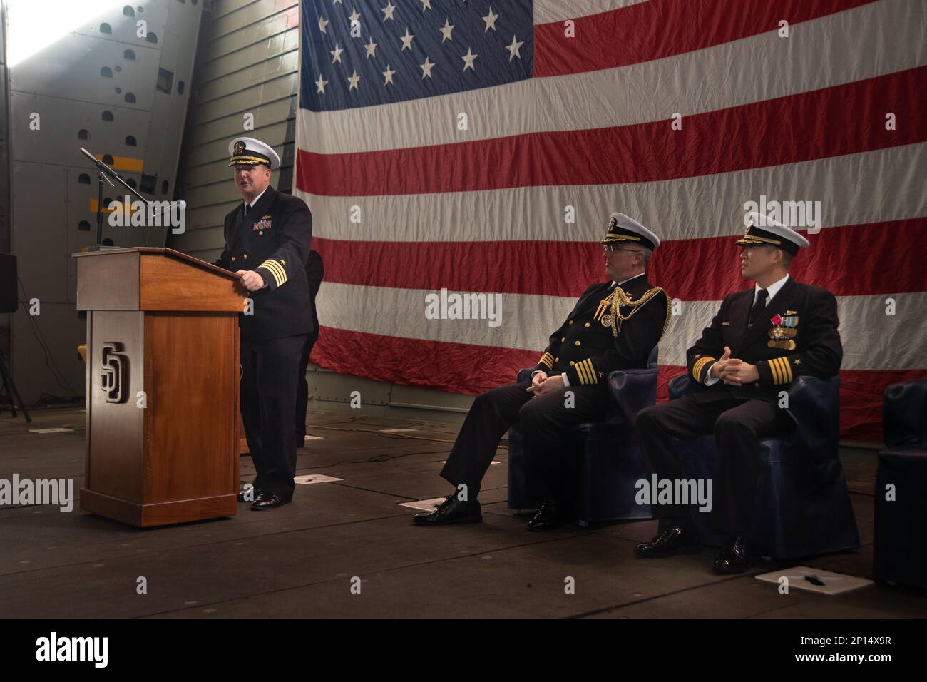 NAVAL BASE SAN DIEGO (Jan. 12, 2023) Capt. Ryan Rogers, left, provides ...