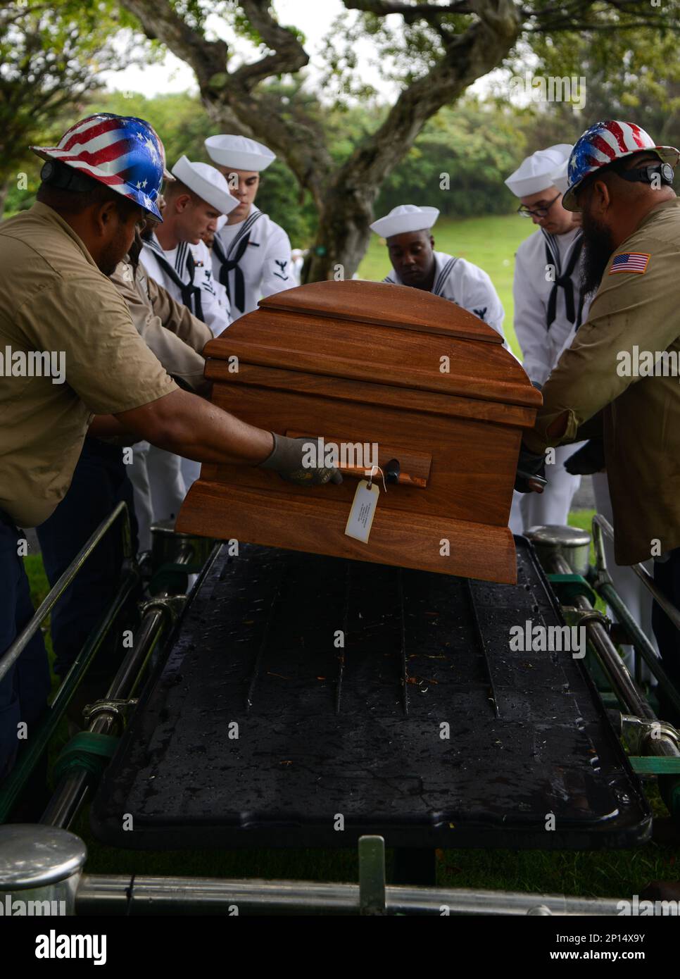 Members of the National Memorial Cemetery of the Pacific (NMCP) team ...
