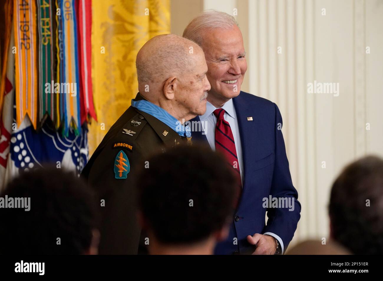 President Joe Biden stands with retired Army Col. Paris Davis after ...