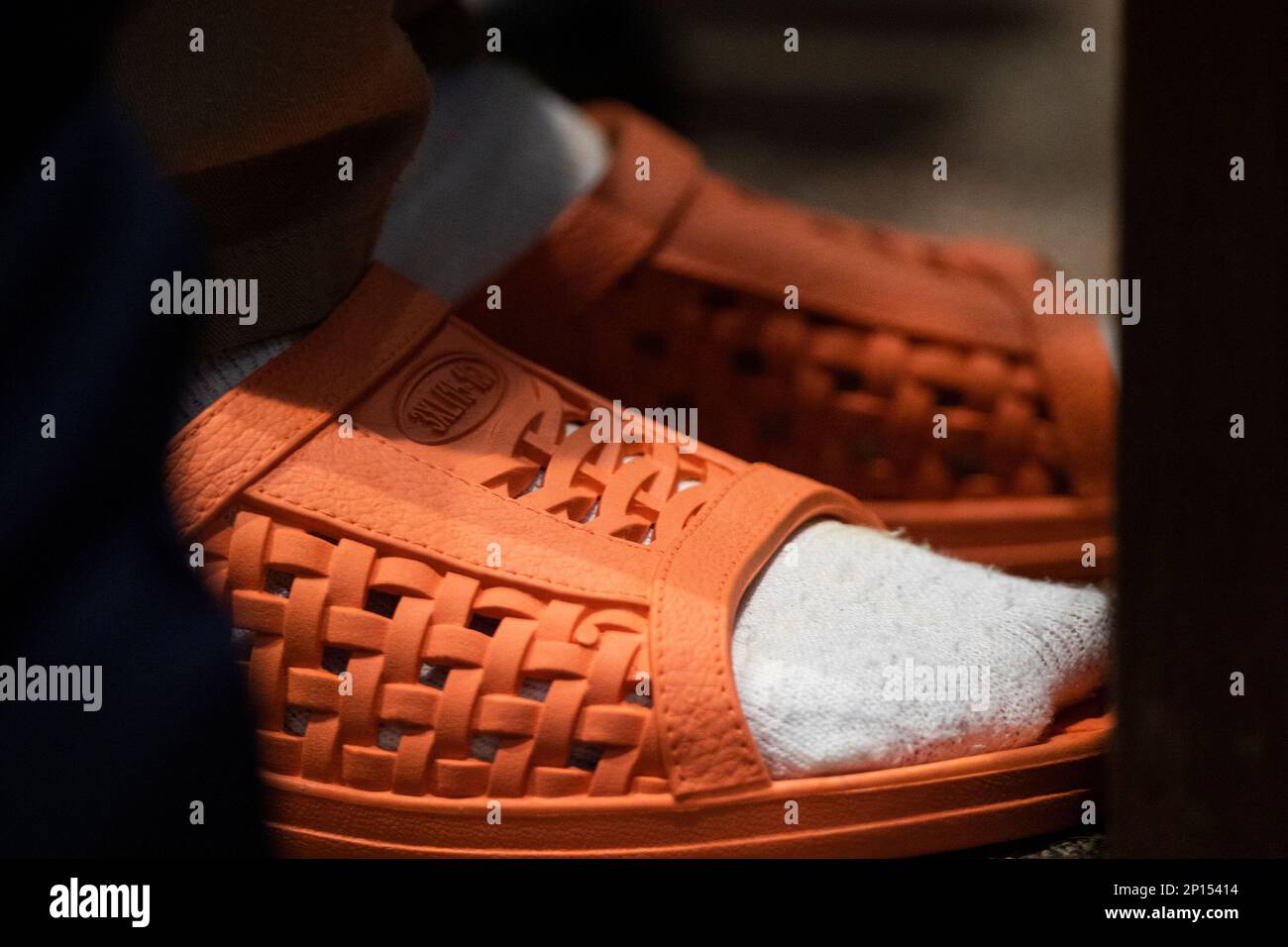 A closeup of Alex Murdaugh's prison footwear is shown as he is ...