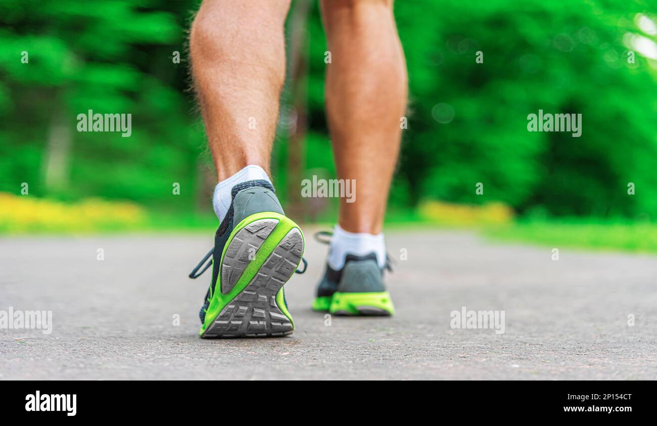 Athlete's legs in sneakers on a run Stock Photo - Alamy