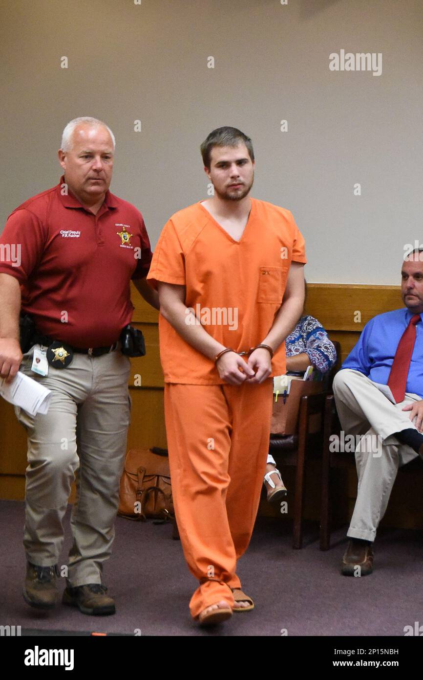 David Isaiah Godwin, of Newport, N.C., is escorted into Carteret County ...