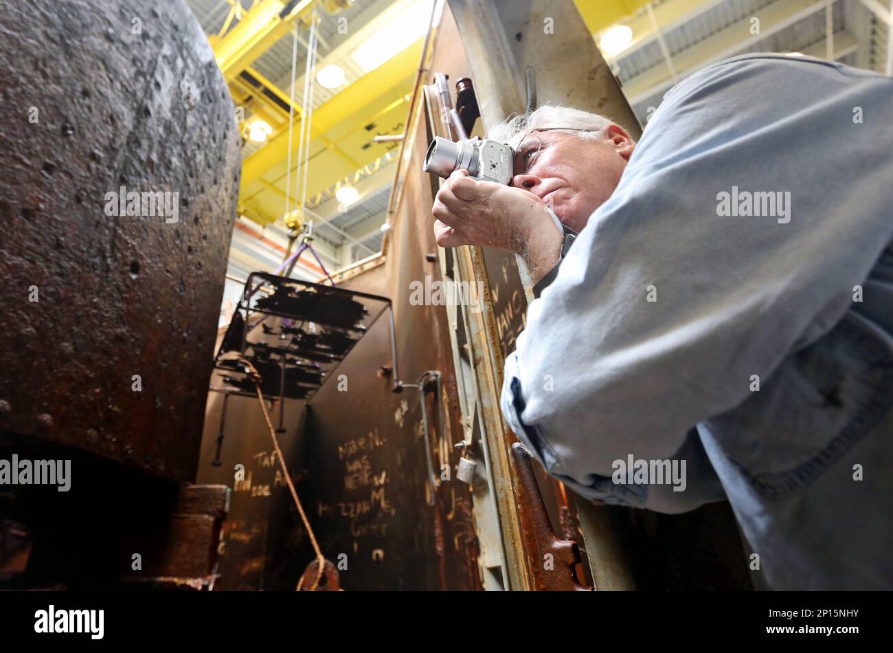 While visiting the Mariners' Museum Jim Wetherbee takes a photograph of ...