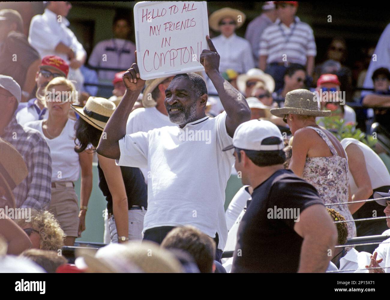 Richard Williams, father of Venus and Serena Williams, holds a sign up ...