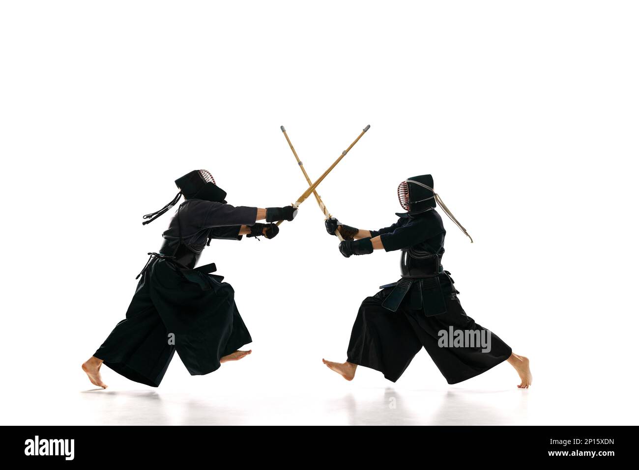 Dynamic image of two men, professional kendo athletes training with ...