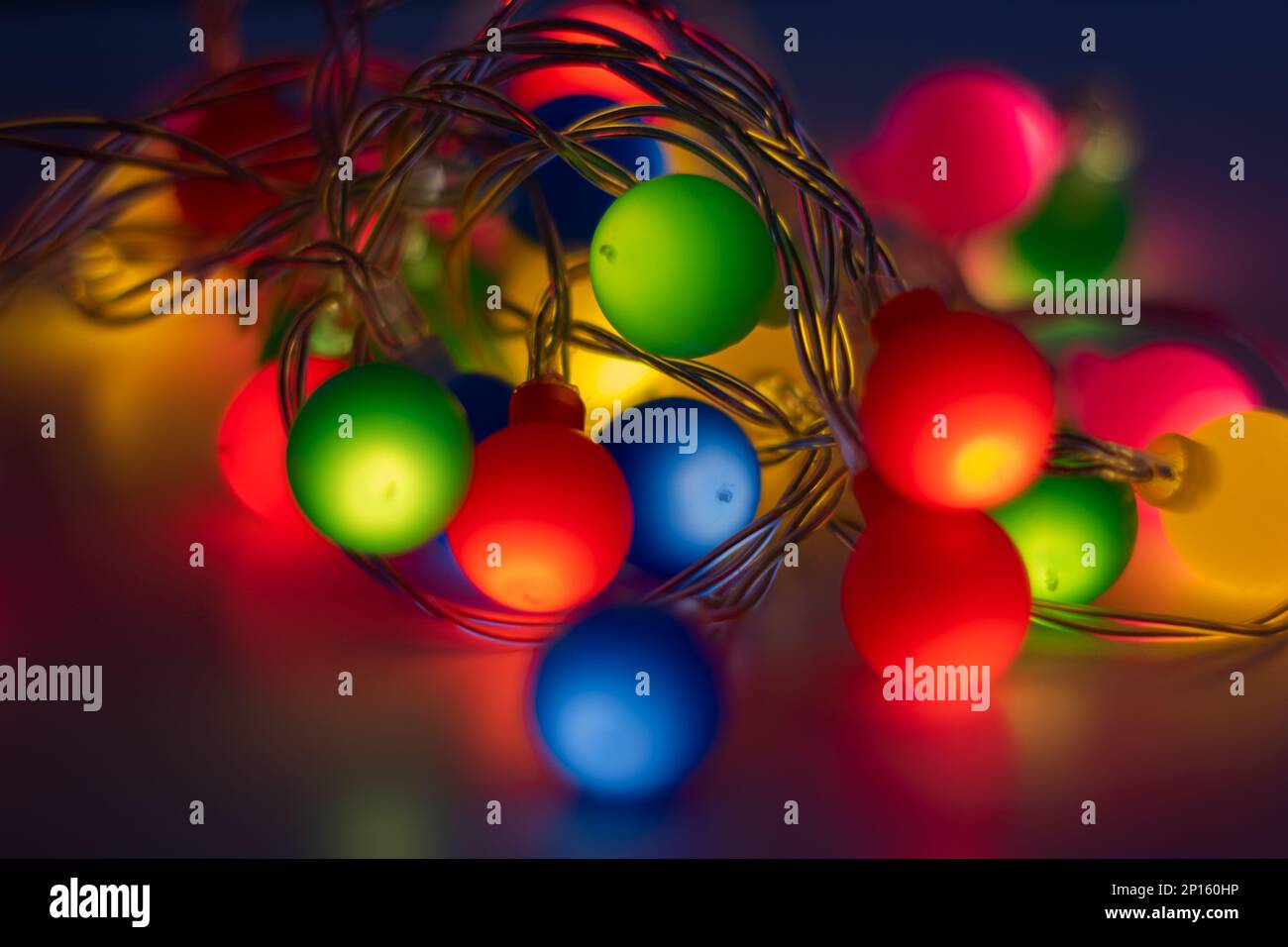 Bunch of colored electric decorative lights and wires macro close up ...