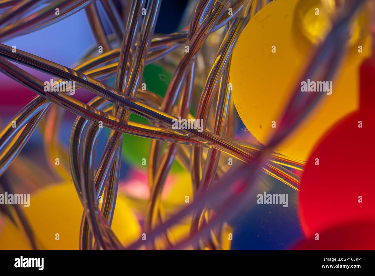 Bunch of colored electric decorative lights and wires macro close up ...