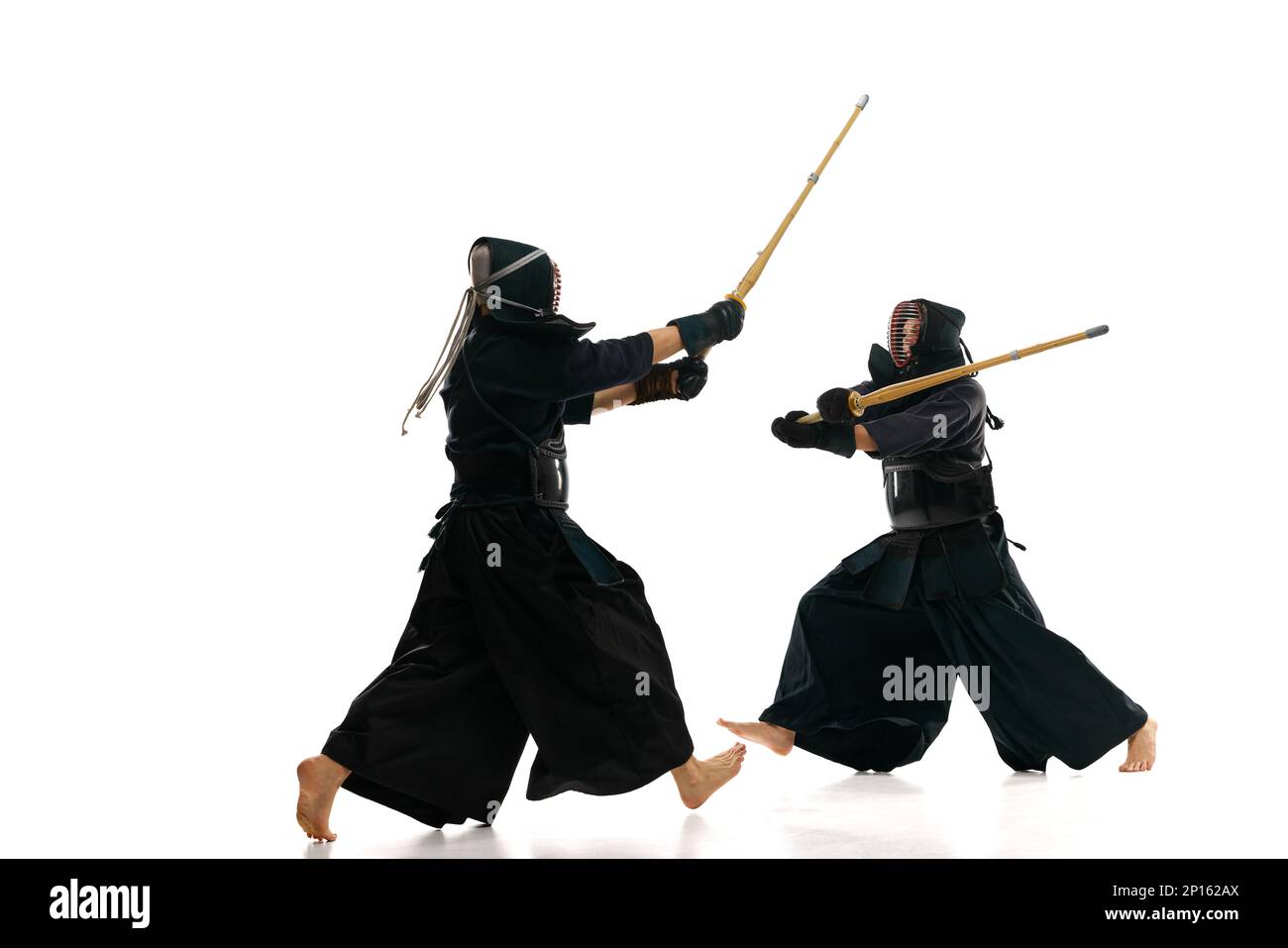 Two men, professional kendo athletes in motions, fighting, training ...
