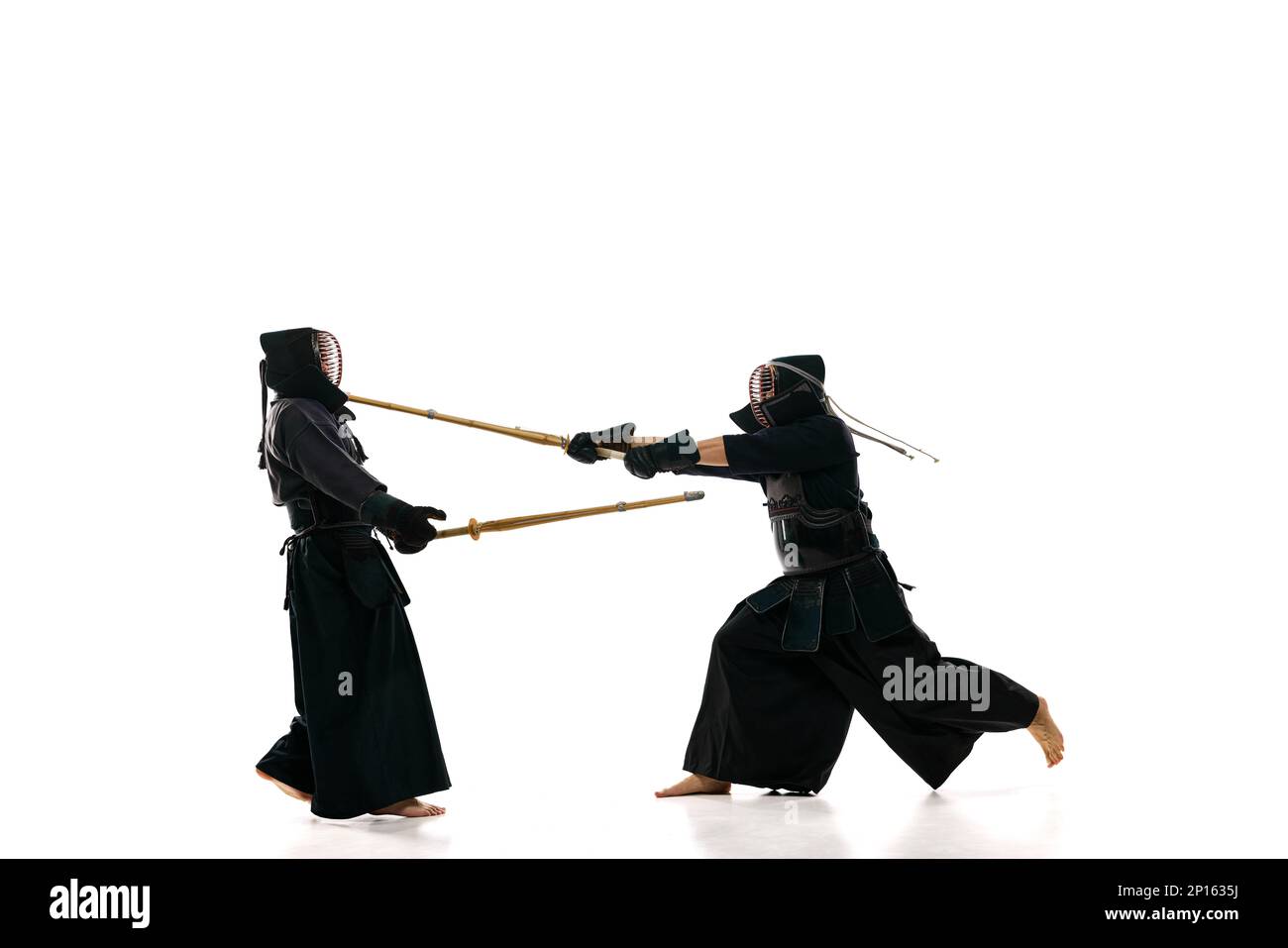 Men, professional kendo athletes in uniform raining with shinai sword ...