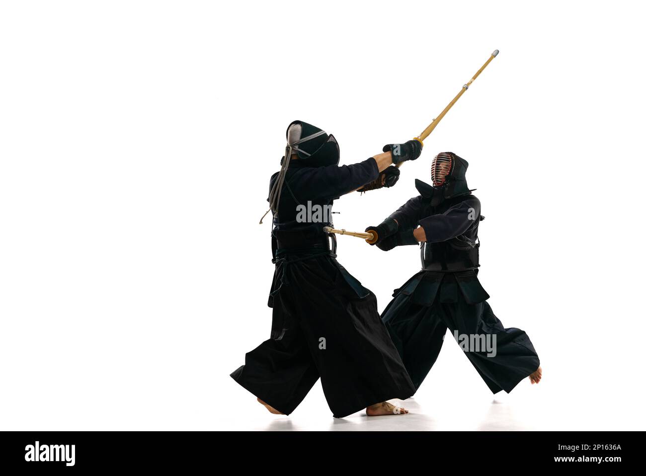 Two men, professional kendo athletes in uniform with helmet training ...