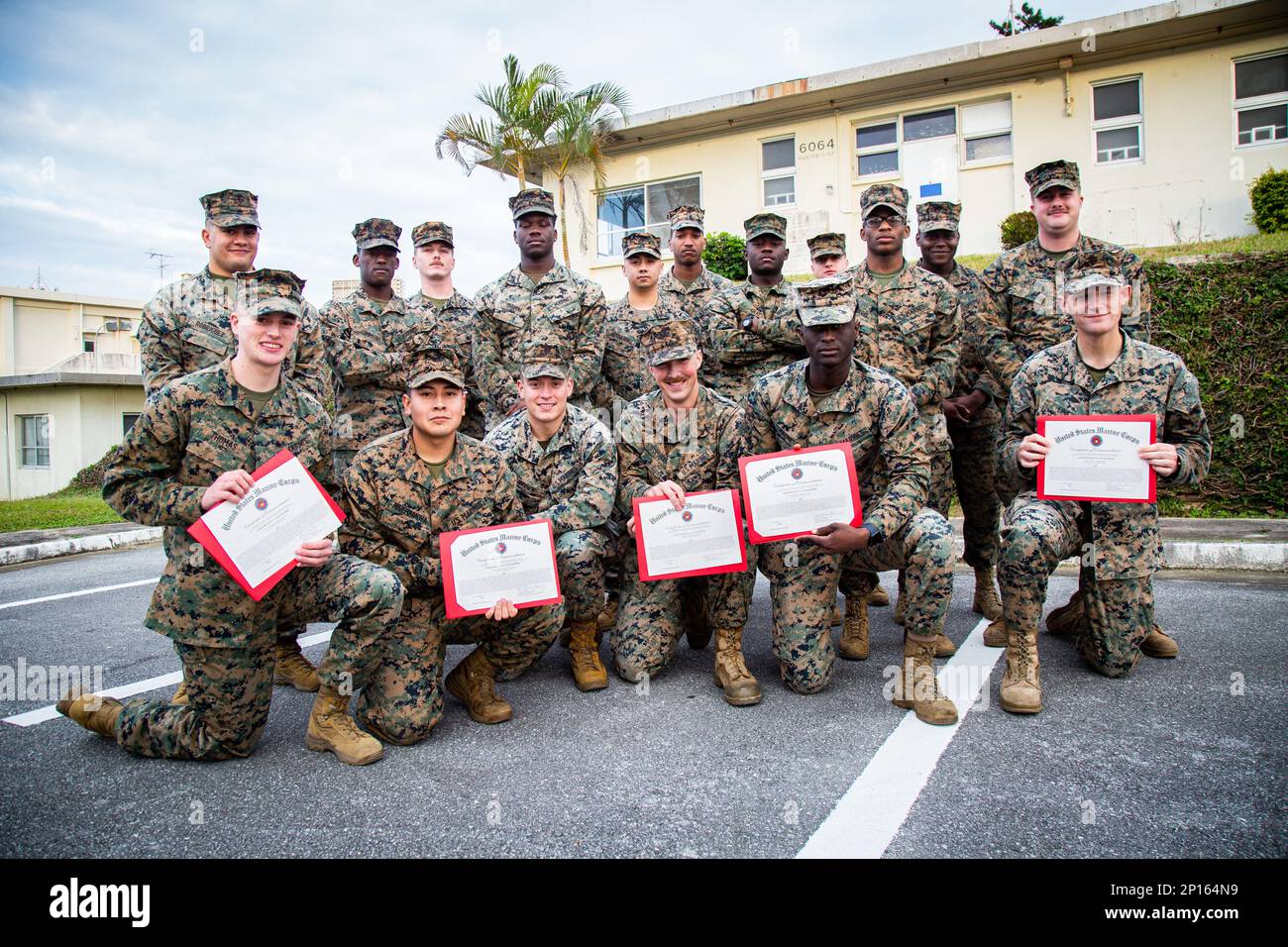 U.S. Marines with Camp Services, Marine Corps Base Butler, poses for a ...