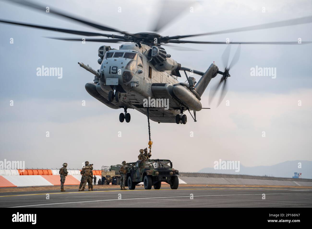 U.S. Marines with Combat Logistics Battalion 31, secure a Humvee to a ...