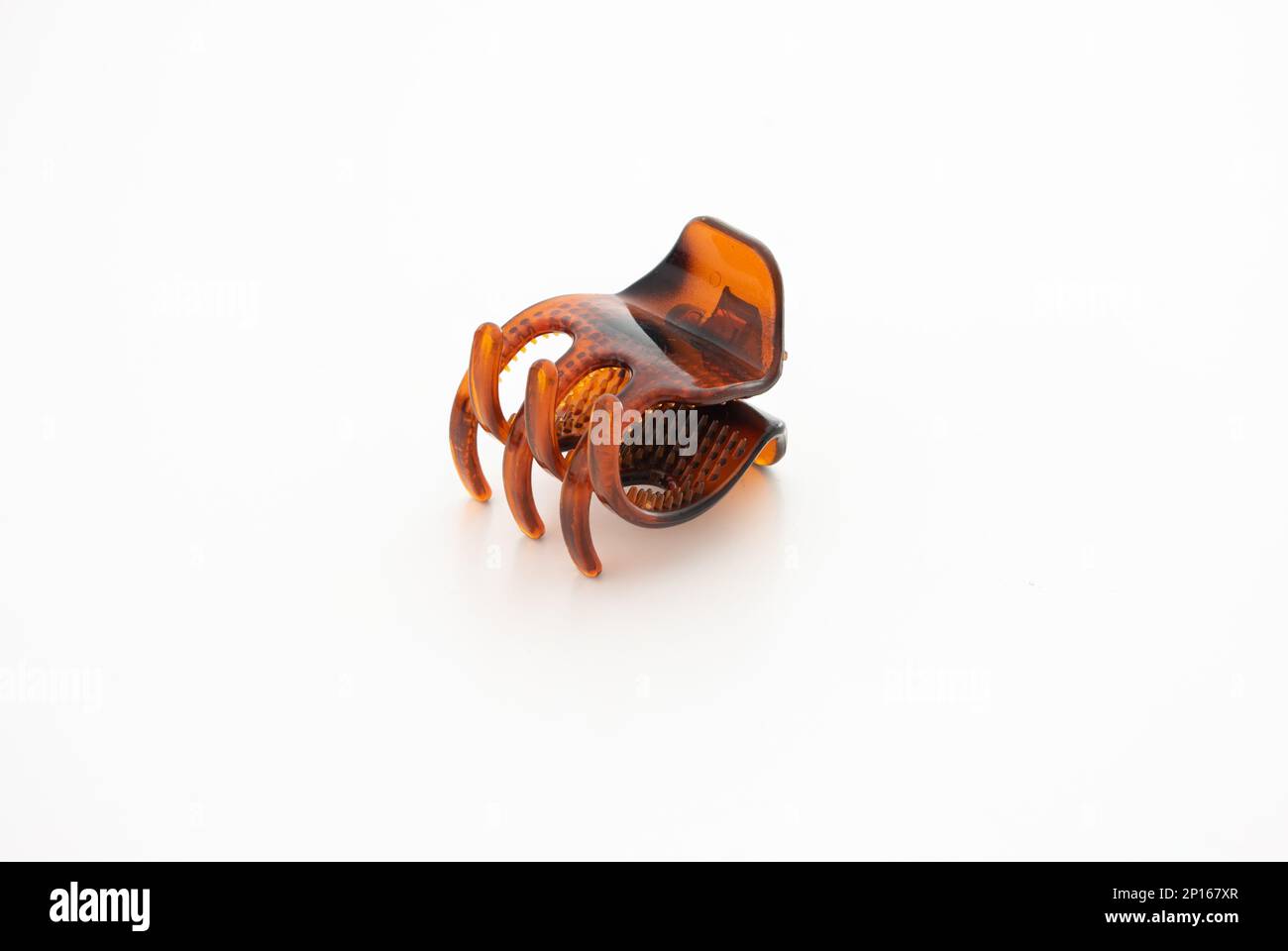 Plastic amber hair claw close up studio shot isolated on white ...