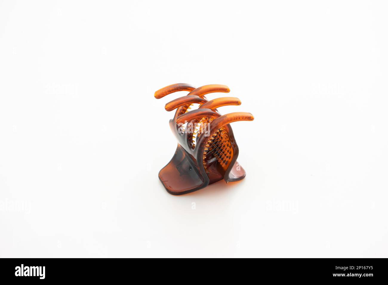 Plastic amber hair claw close up studio shot isolated on white ...
