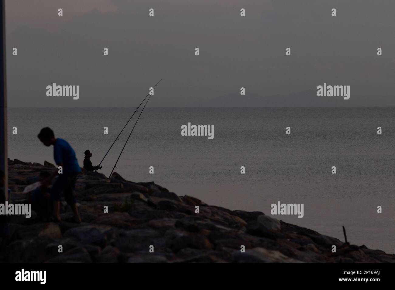 Locals Fish of the Water Break on the Coast of Pontian, Malaysia Stock ...