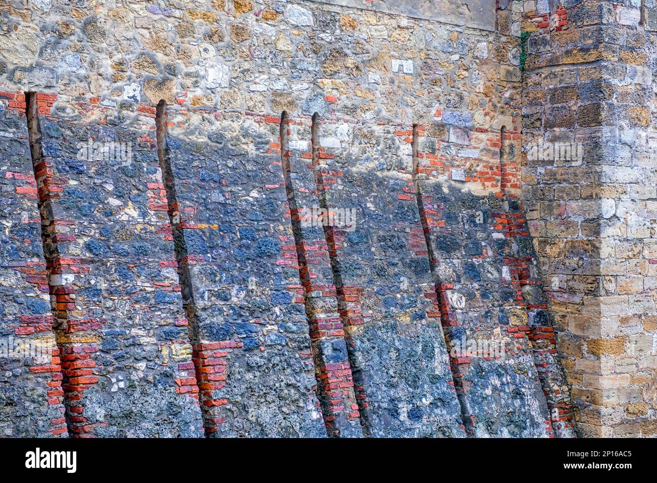 Feature of a stone fortified wall with slits in the former medieval ...