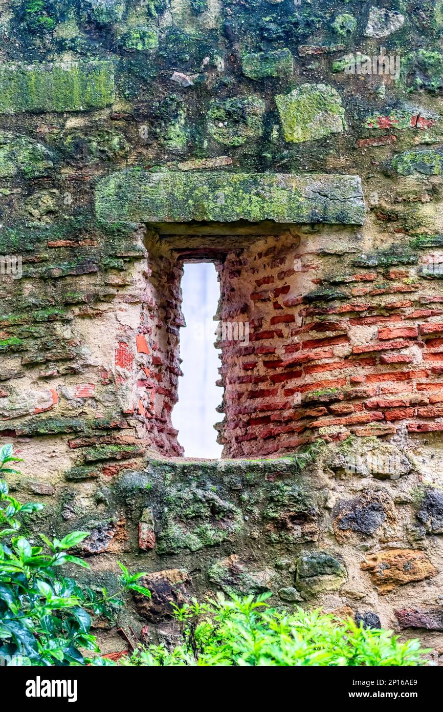 Feature of a stone fortified wall with slits in the former medieval ...