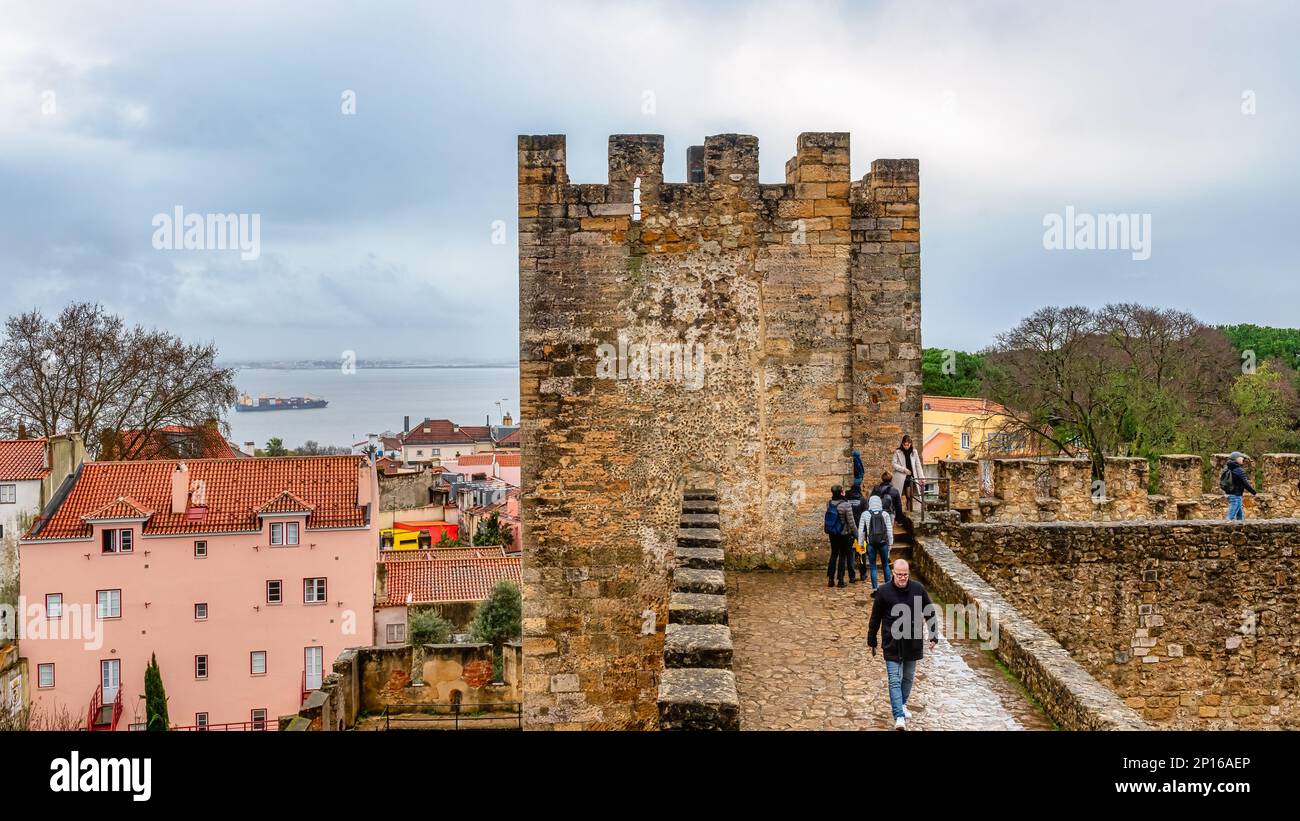 Fortified wall with tower and merlons. Exterior view of the former ...