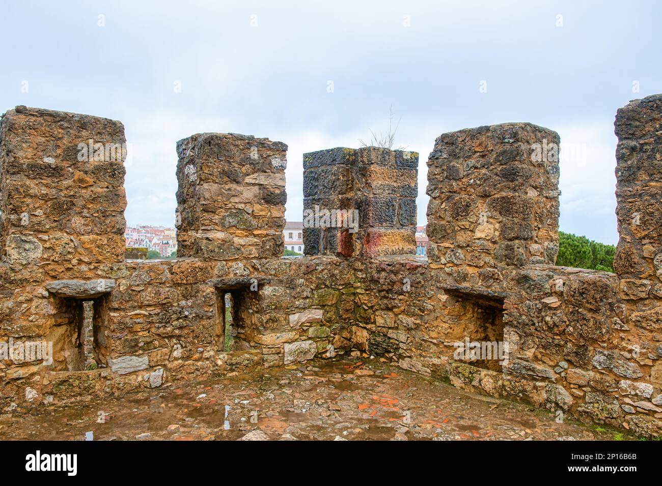 Merlons on top of a fortified tower wall. The medieval military fort is ...