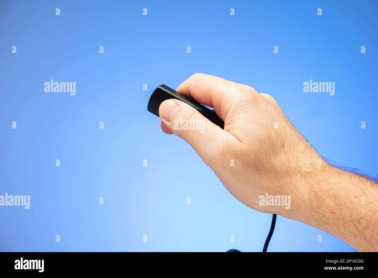 Man pressing handheld button hi-res stock photography and images - Alamy