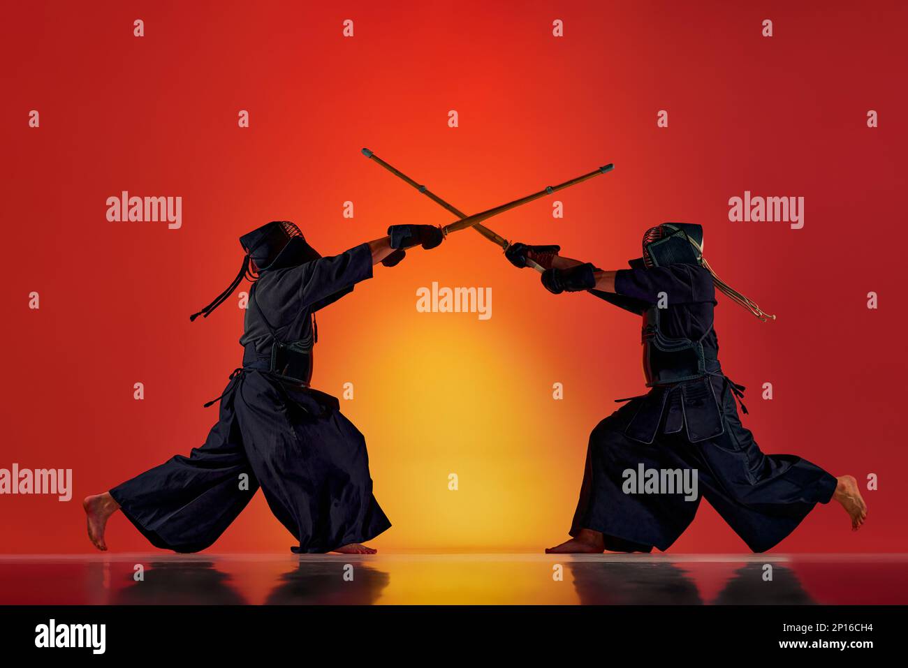 Dynamic image of two men, professional kendo athletes training with ...