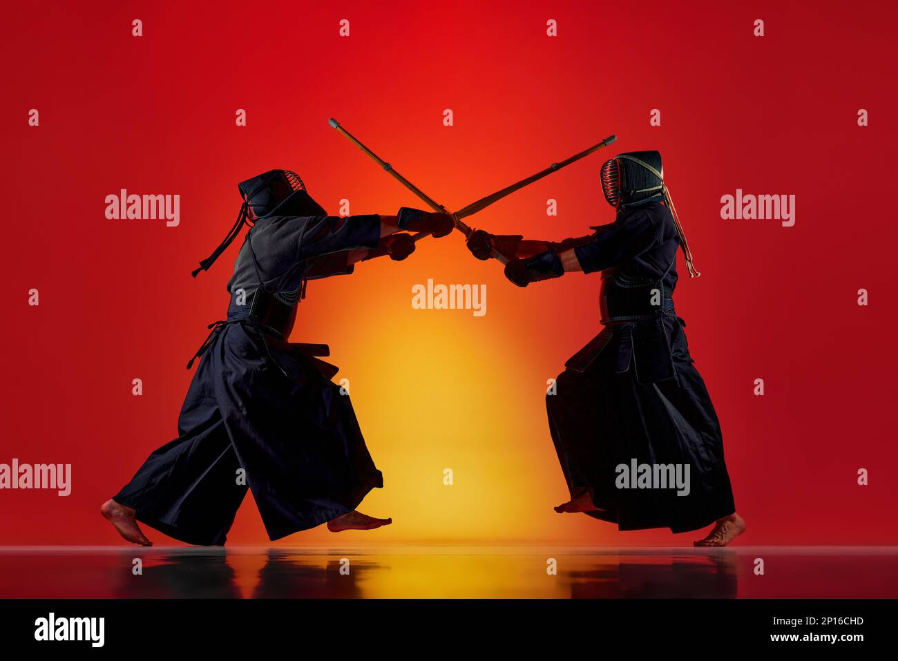 Dynamic image of two men, professional kendo athletes training with ...