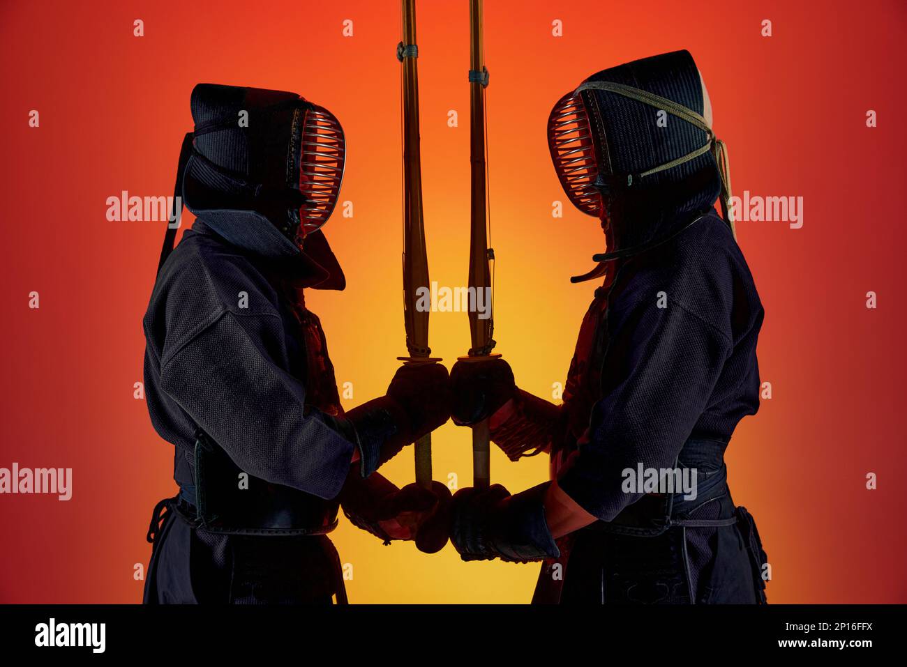 Sword to sword. Two men, professional kendo fighter, athletes in black ...
