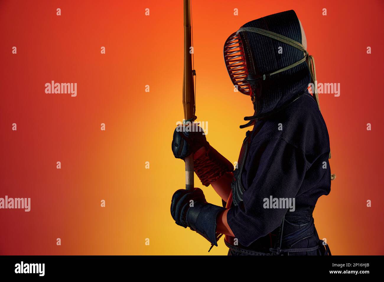 Side view. Portrait of man, professional kendo athlete in uniform ...