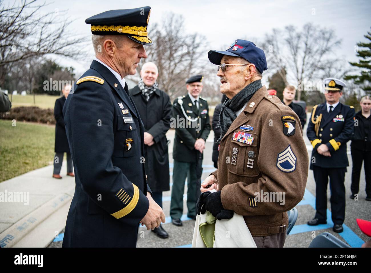 Chief of Staff of the Army Gen. James McConville (left) speaks with ...